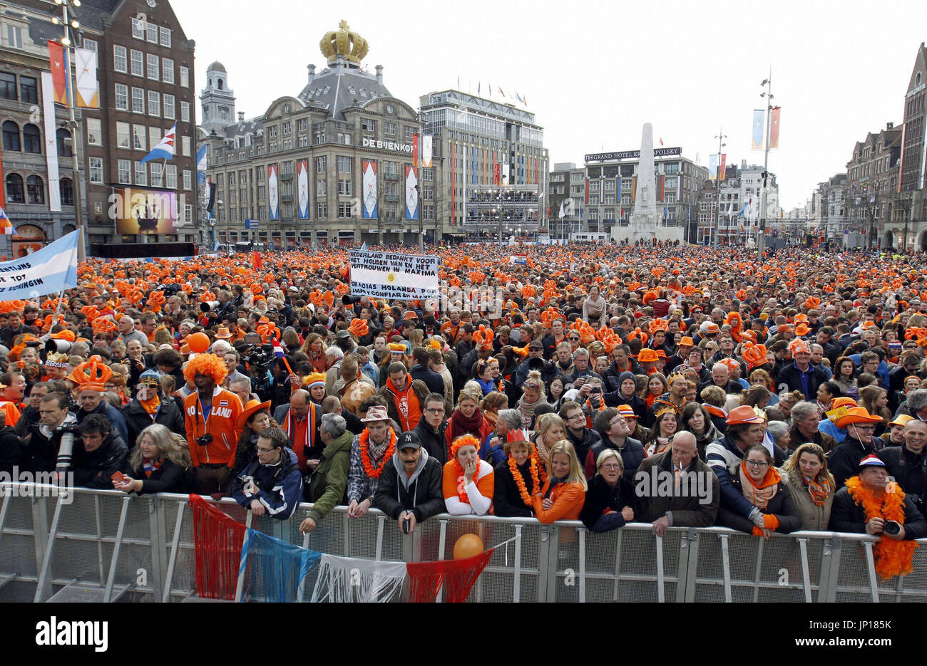 AMSTERDAM, Netherlands - A crowd assembles in front of the royal palace ...