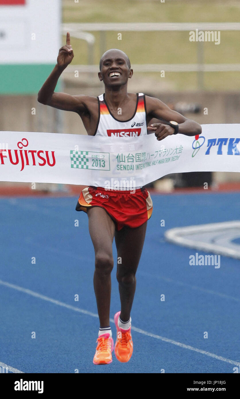 SENDAI, Japan - Kenya's Mekubo Mogusu breaks the finishing tape at ...