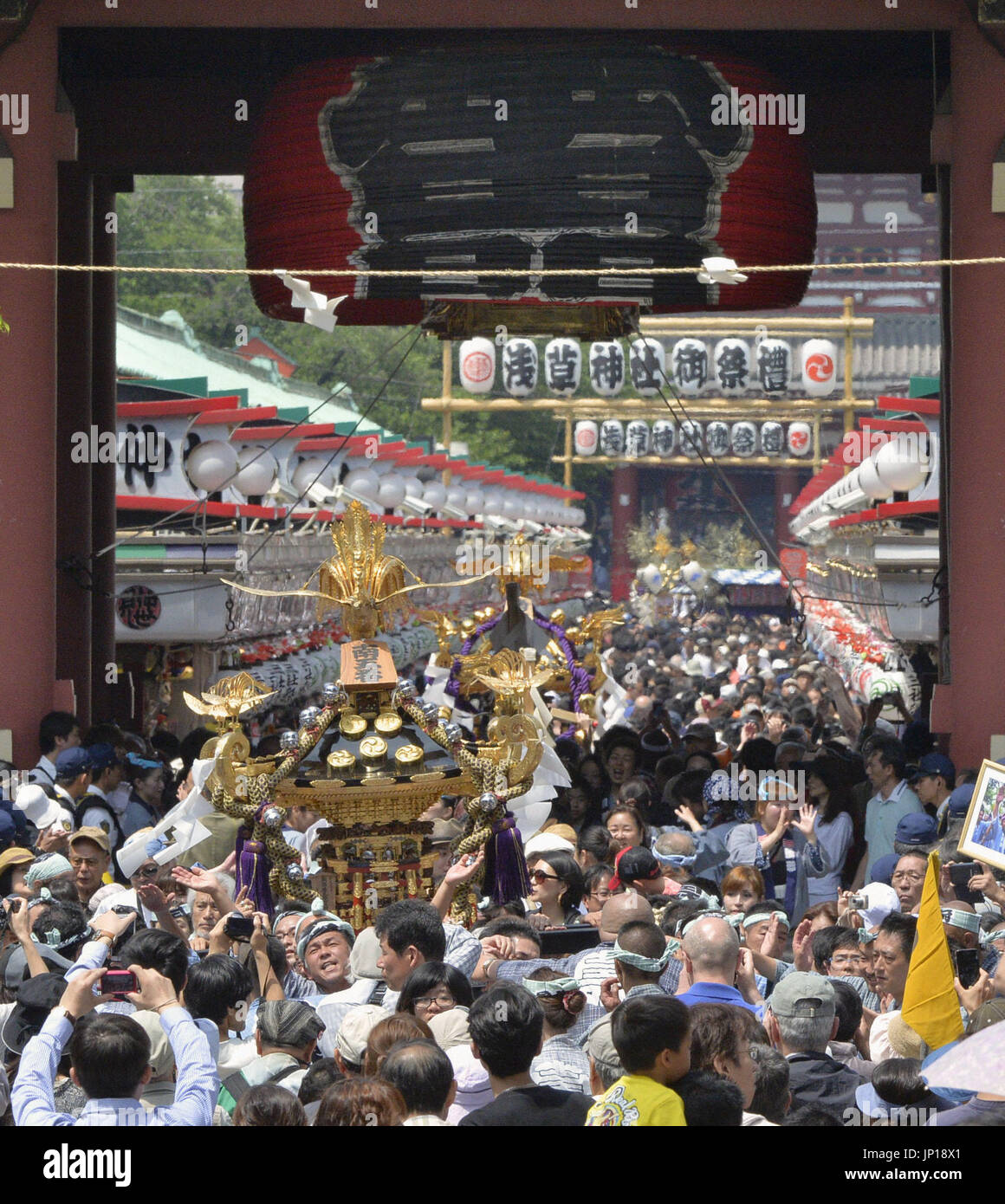 TOKYO, Japan - Portable shrines pass through Kaminari gate of Sensoji ...