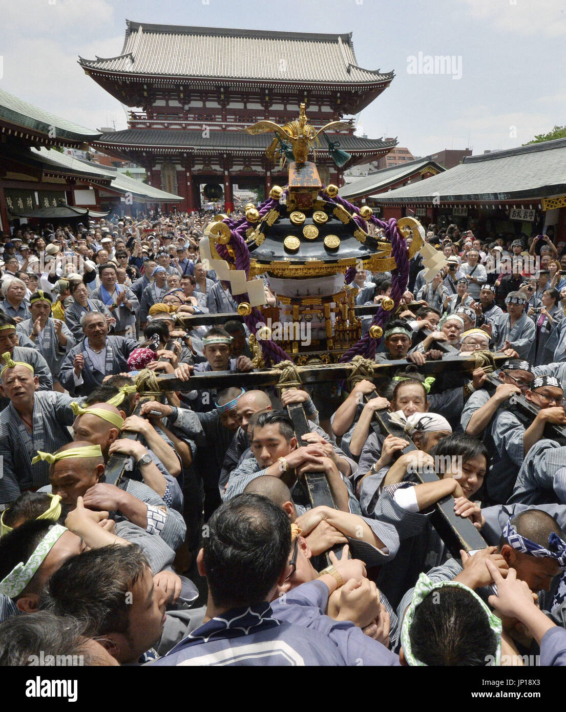 TOKYO, Japan - A portable shrine is carried in the Sensoji temple ...