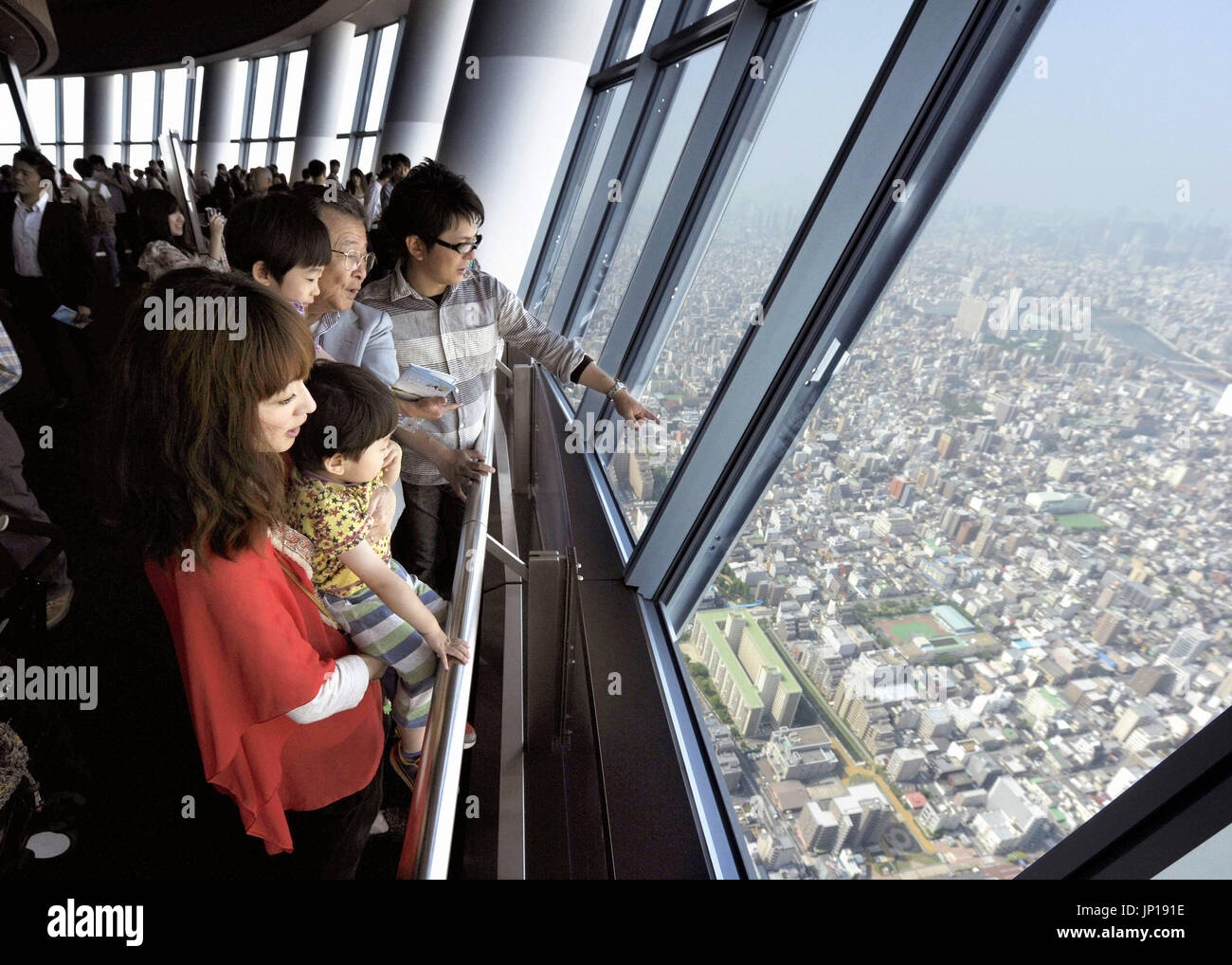 TOKYO, Japan - Visitors view the sights at the "Tembo Deck" observation ...