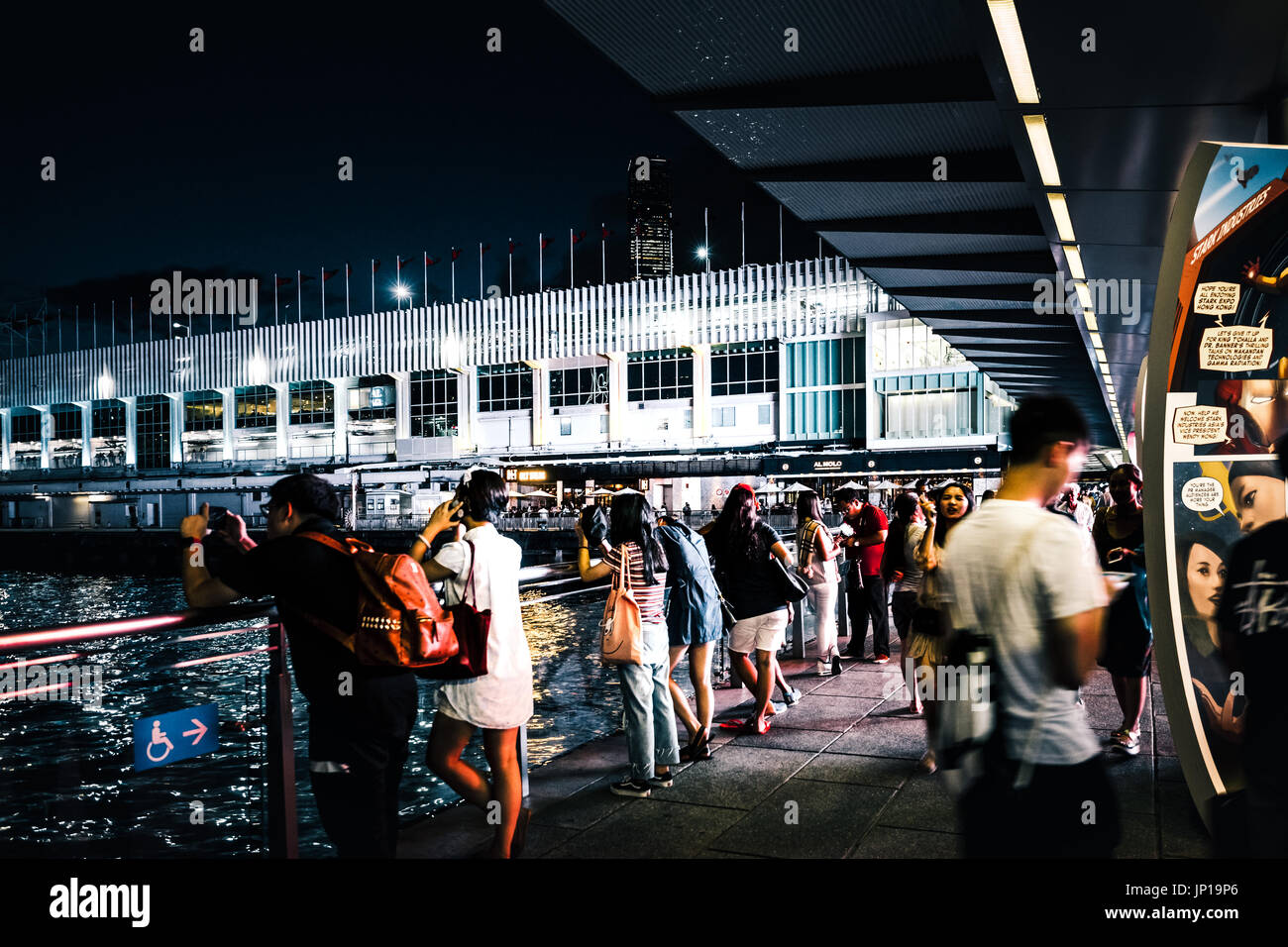 tourist walking on the waterfront at night Stock Photo - Alamy