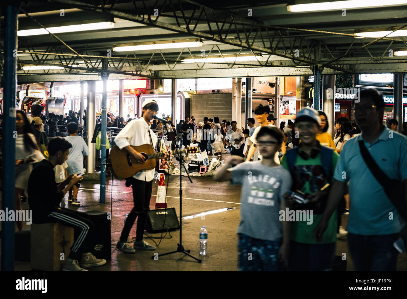 tourist walking on the waterfront at night Stock Photo - Alamy