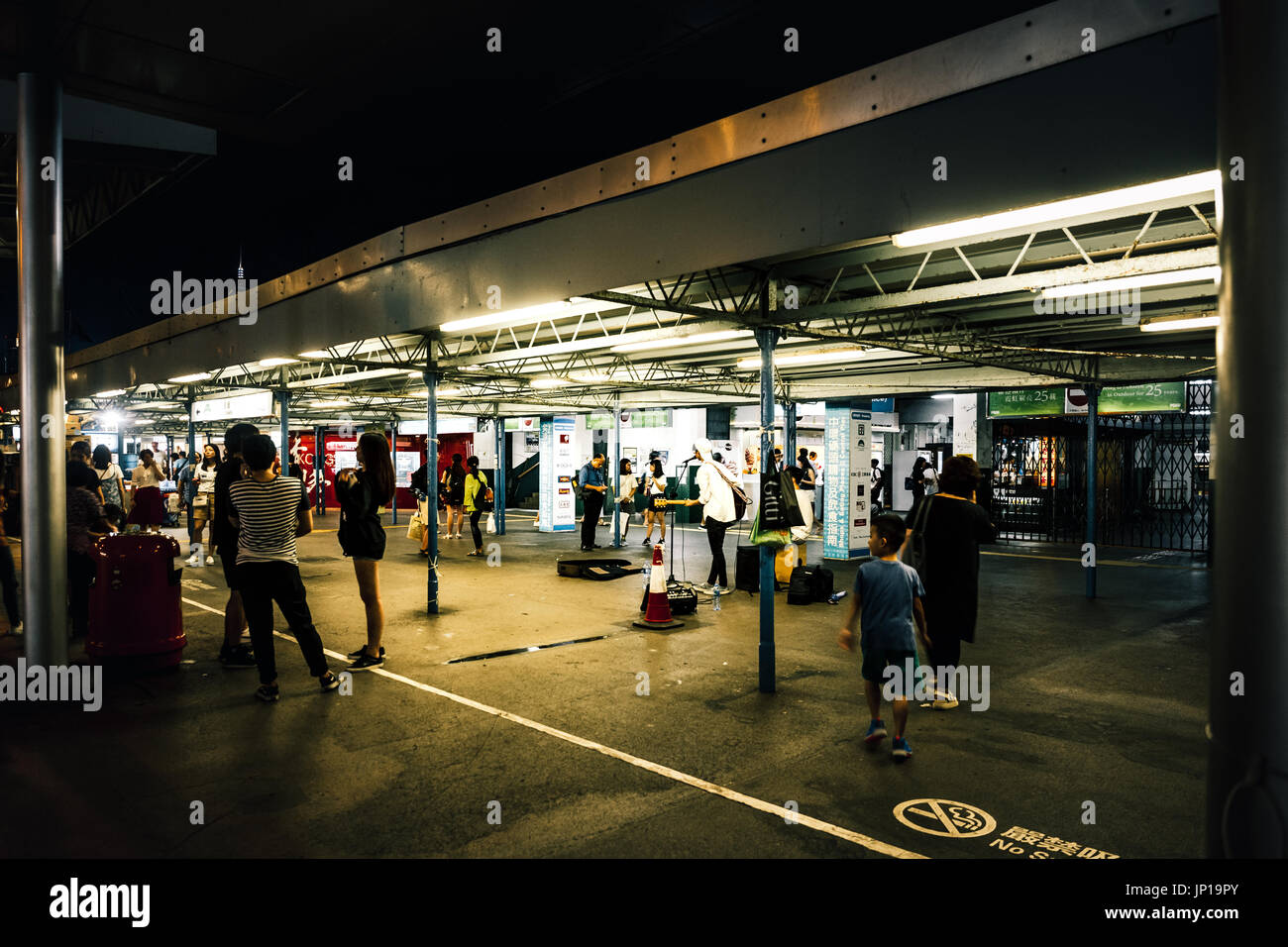 tourist walking on the waterfront at night Stock Photo - Alamy