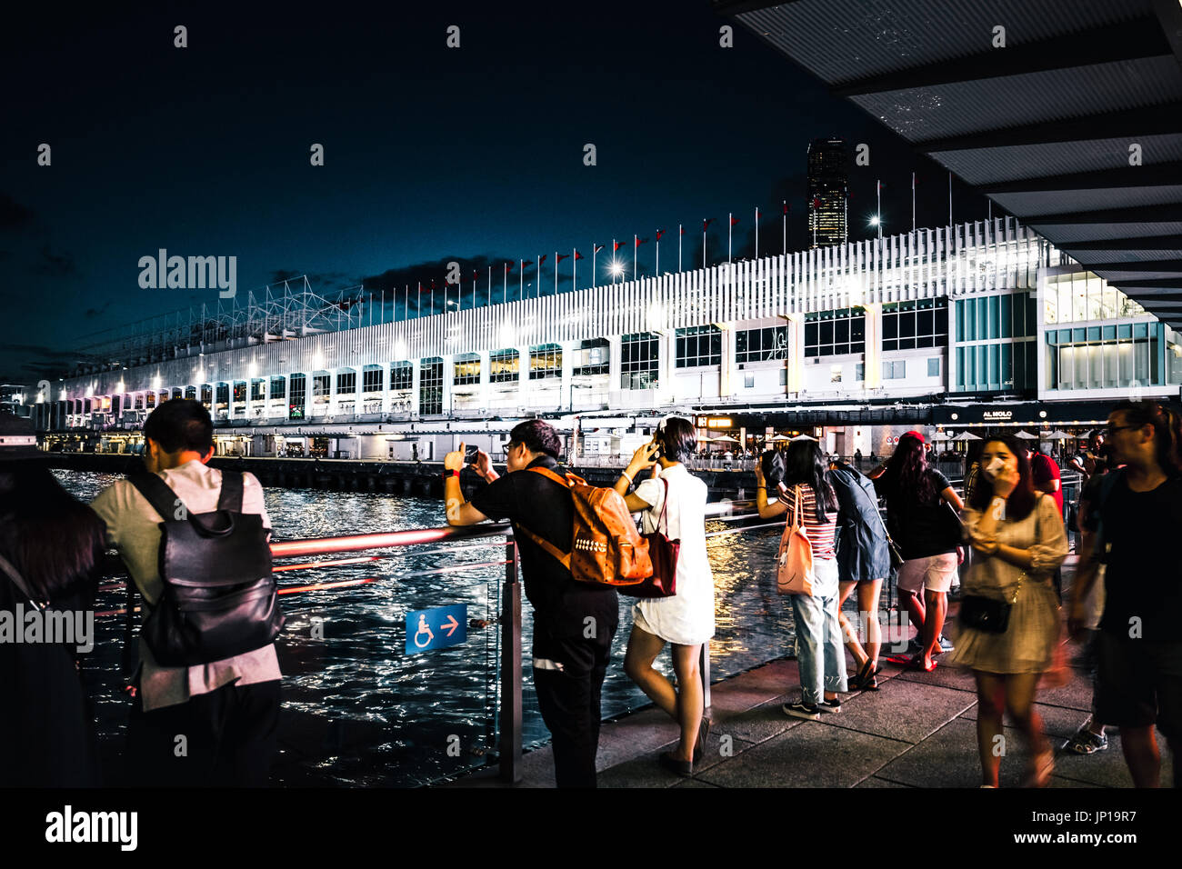 tourist walking on the waterfront at night Stock Photo - Alamy