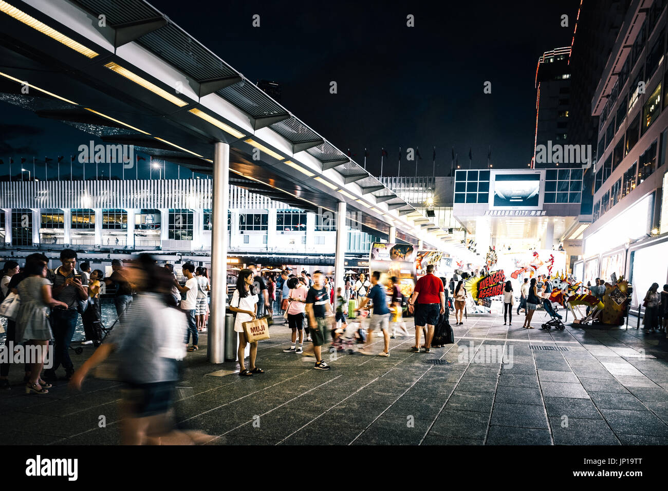 tourist walking on the waterfront at night Stock Photo - Alamy