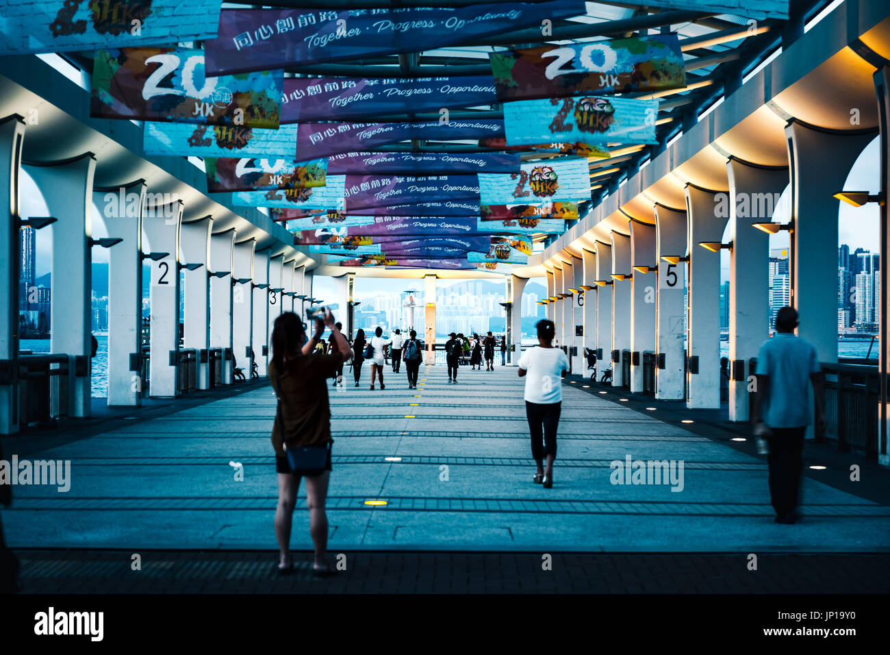tourist walking on the waterfront at night Stock Photo - Alamy