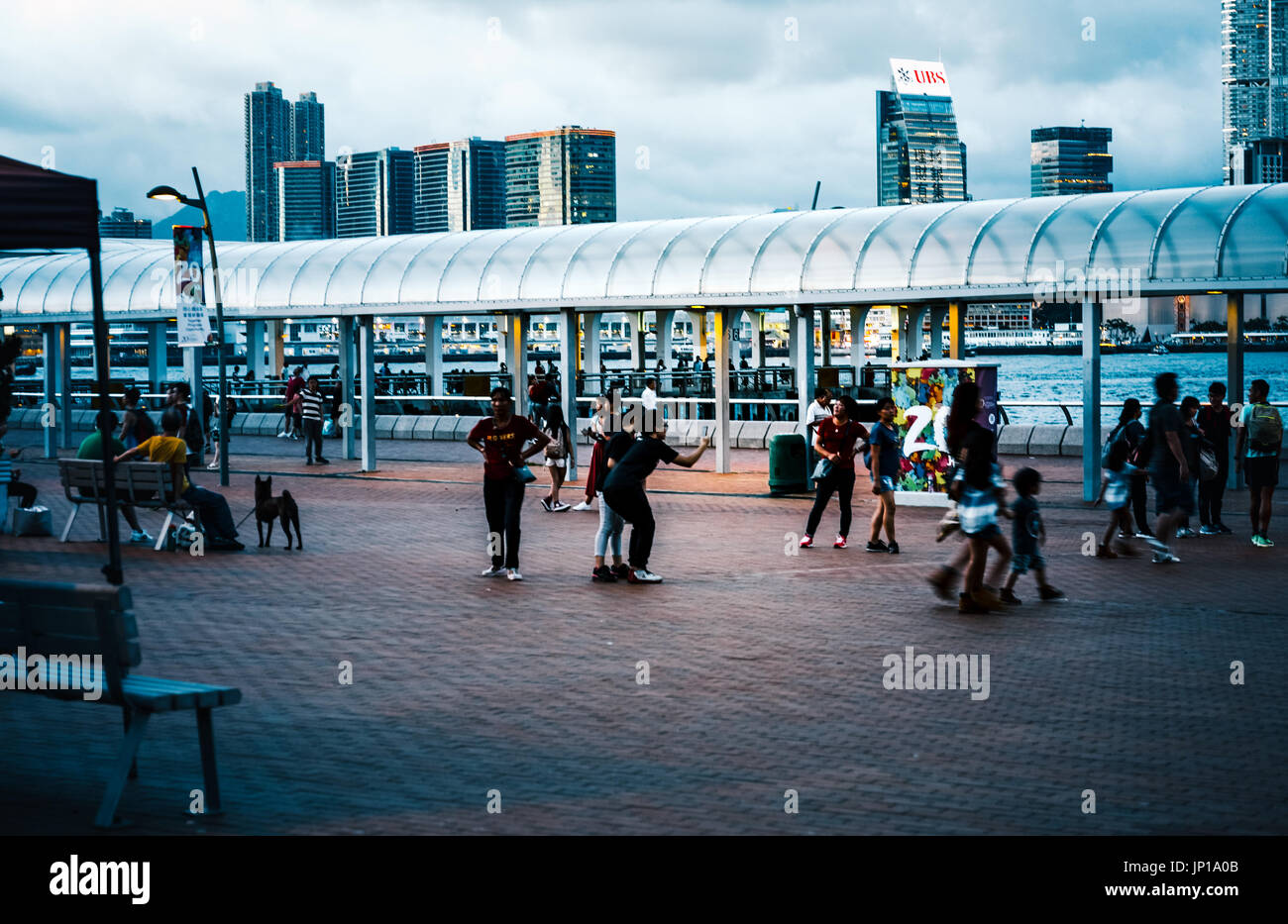 tourist walking on the waterfront at night Stock Photo - Alamy