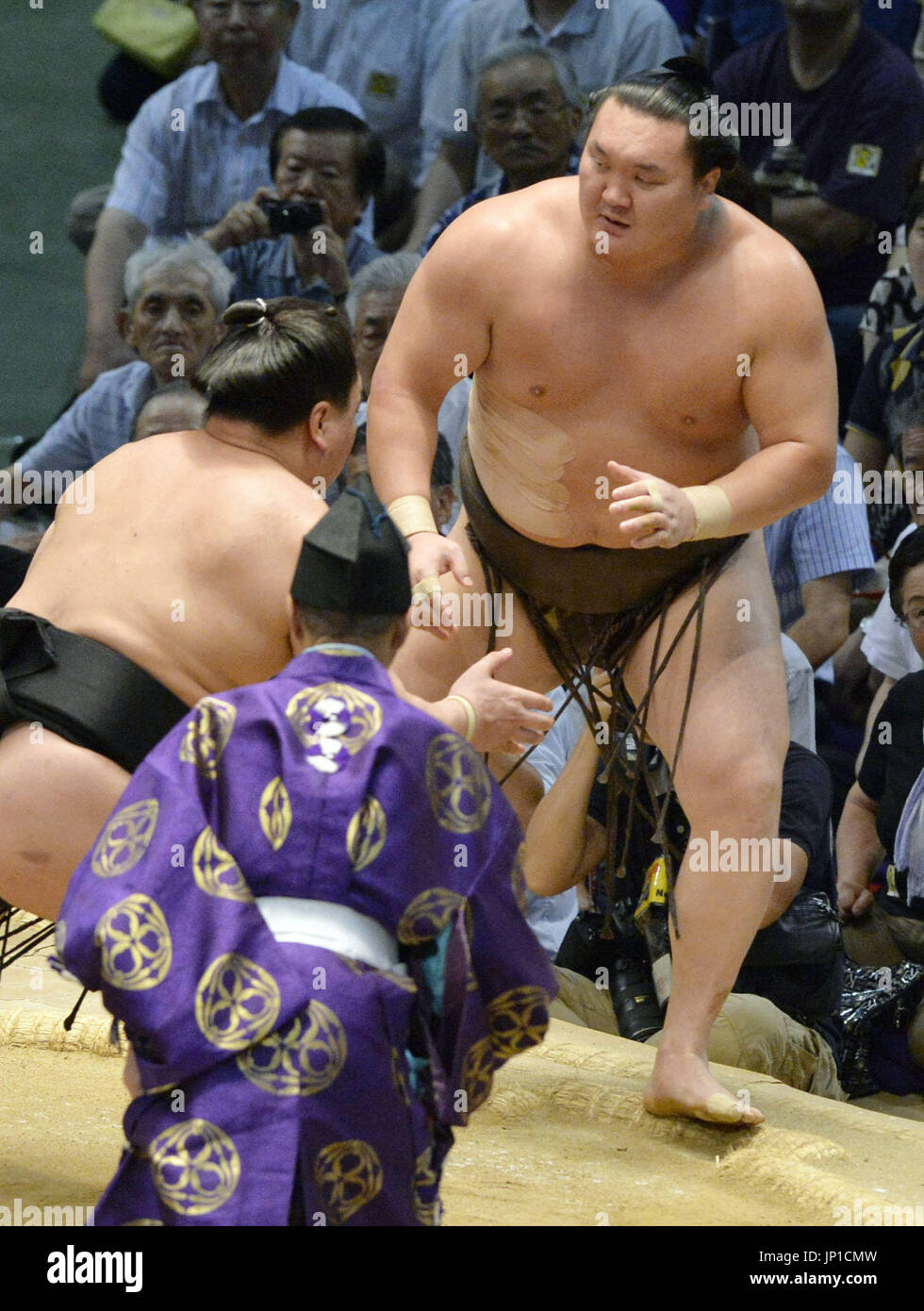 NAGOYA, Japan - Yokozuna Harumafuji (L) pushes fellow Mongolian grand ...