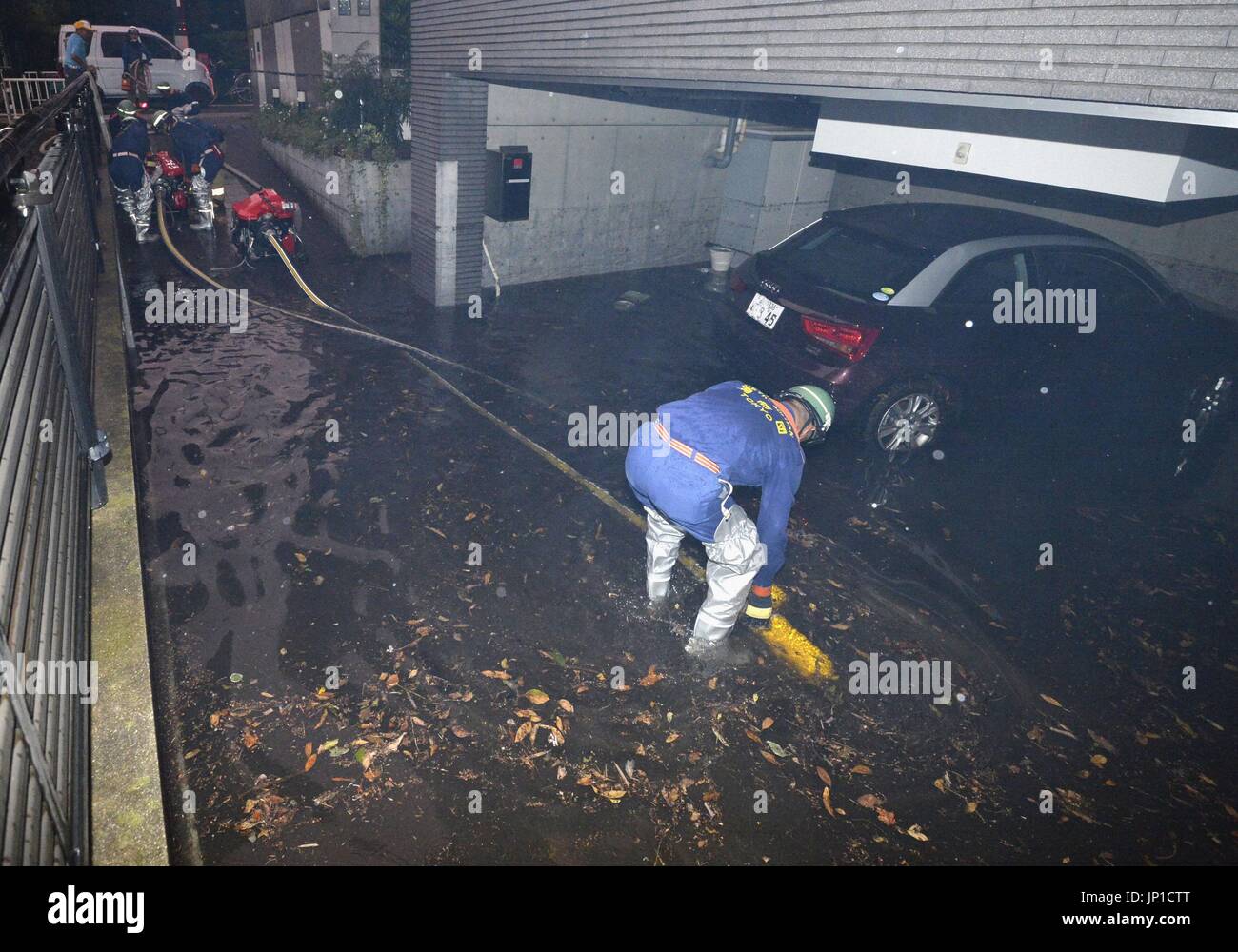 TOKYO, Japan - A parking lot is flooded in Tokyo's Setagaya Ward after ...