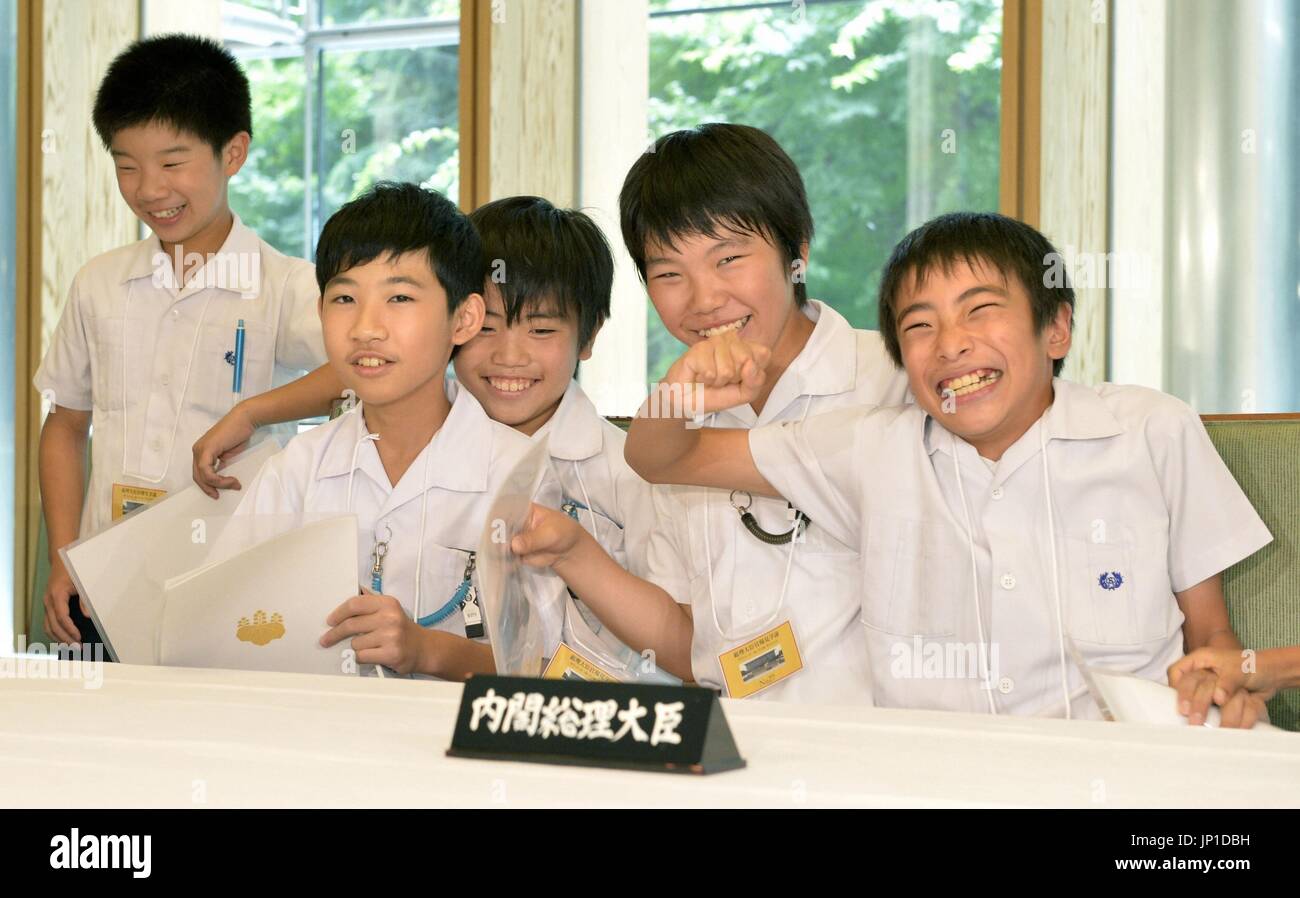TOKYO, Japan - Children smile while sitting in the Japanese prime ...