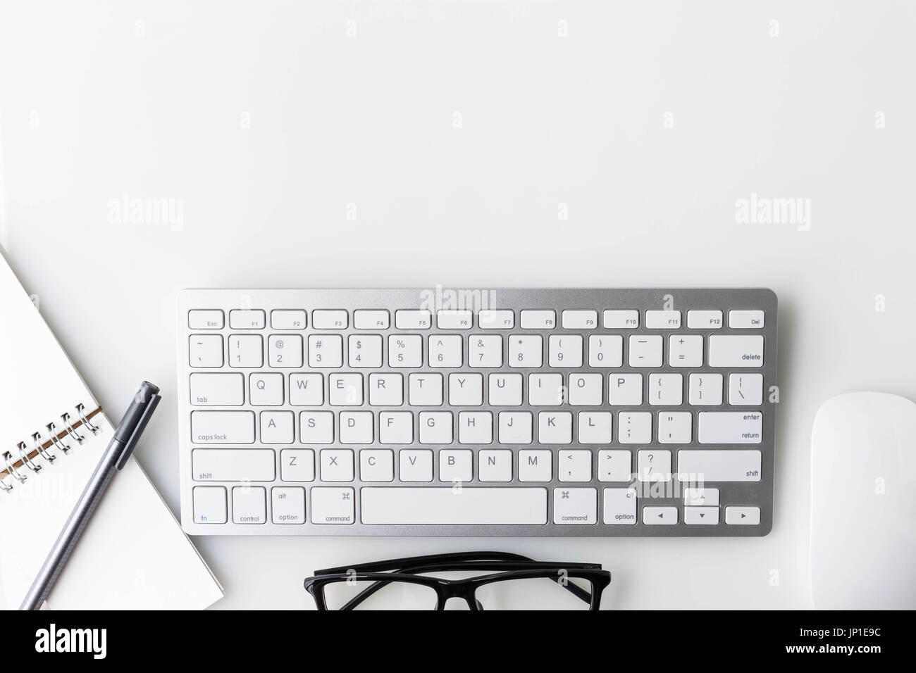 Modern white office desk top table with computer laptop, notebook and ...