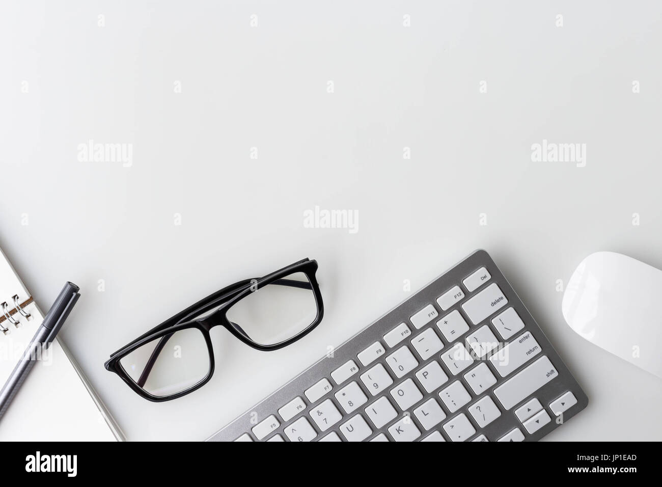 Modern white office desk top table with computer laptop, notebook and ...