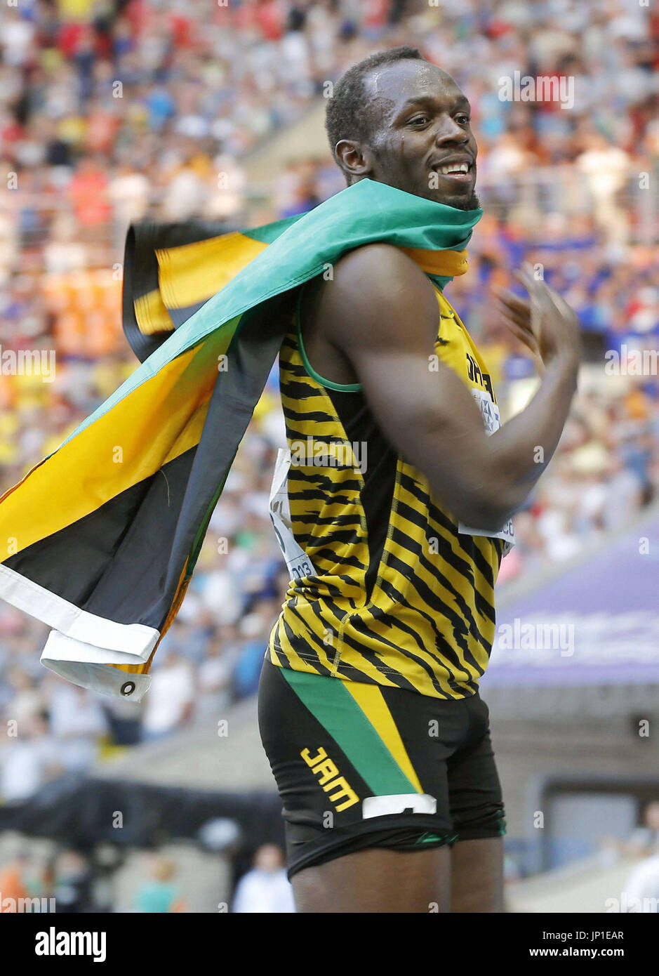 MOSCOW, Russia - Jamaican sprinter Usain Bolt smiles with the Jamaican ...