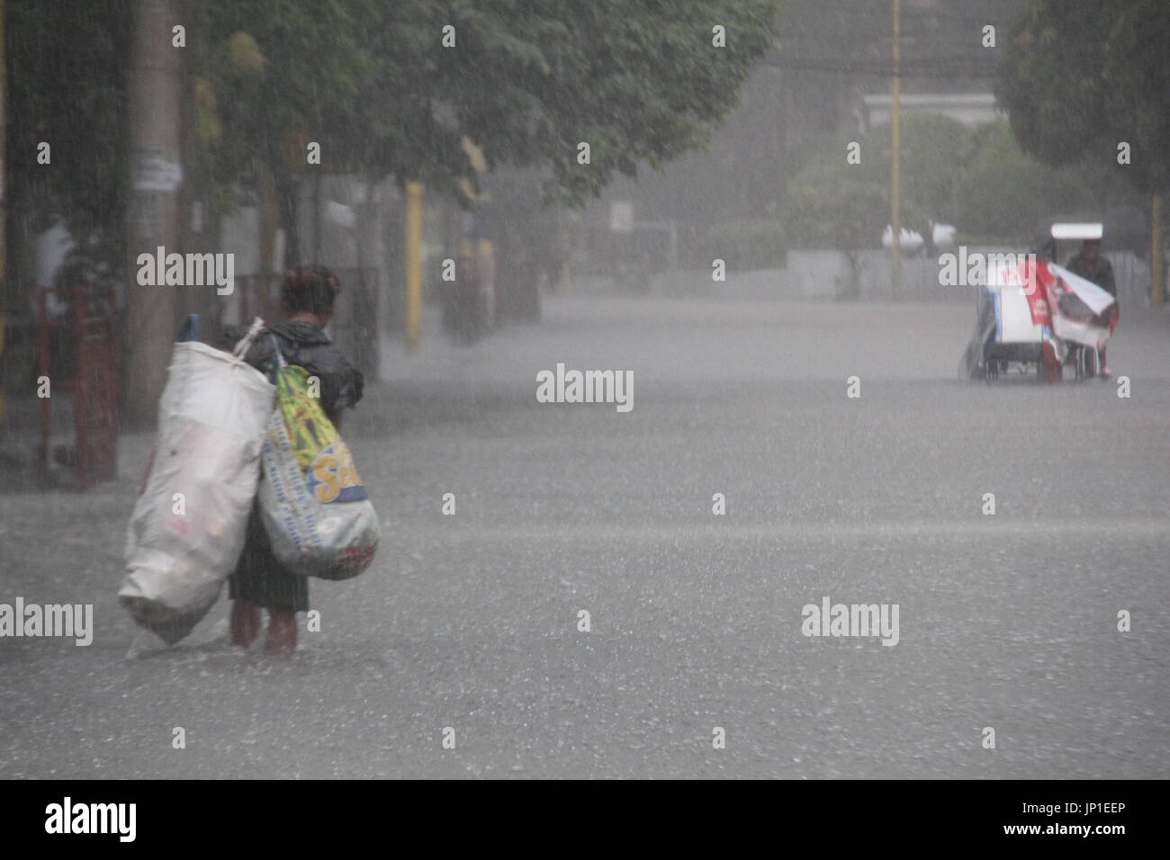 MANILA, Philippines - A road is flooded after heavy rain in Makati in ...
