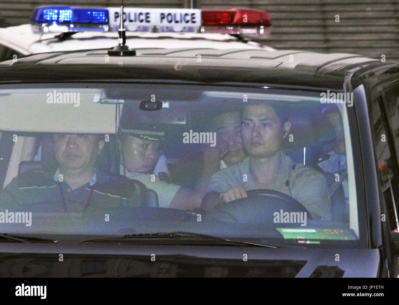 JINAN, China - A police vehicle carrying Bo Xilai (3rd from L), a ...