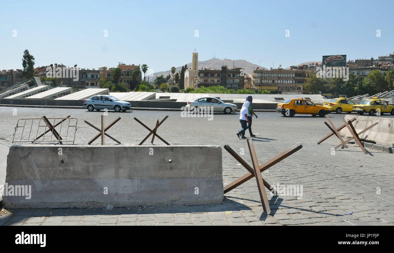 DAMASCUS, Syria - Photo shows a military checkpoint on a road leading ...
