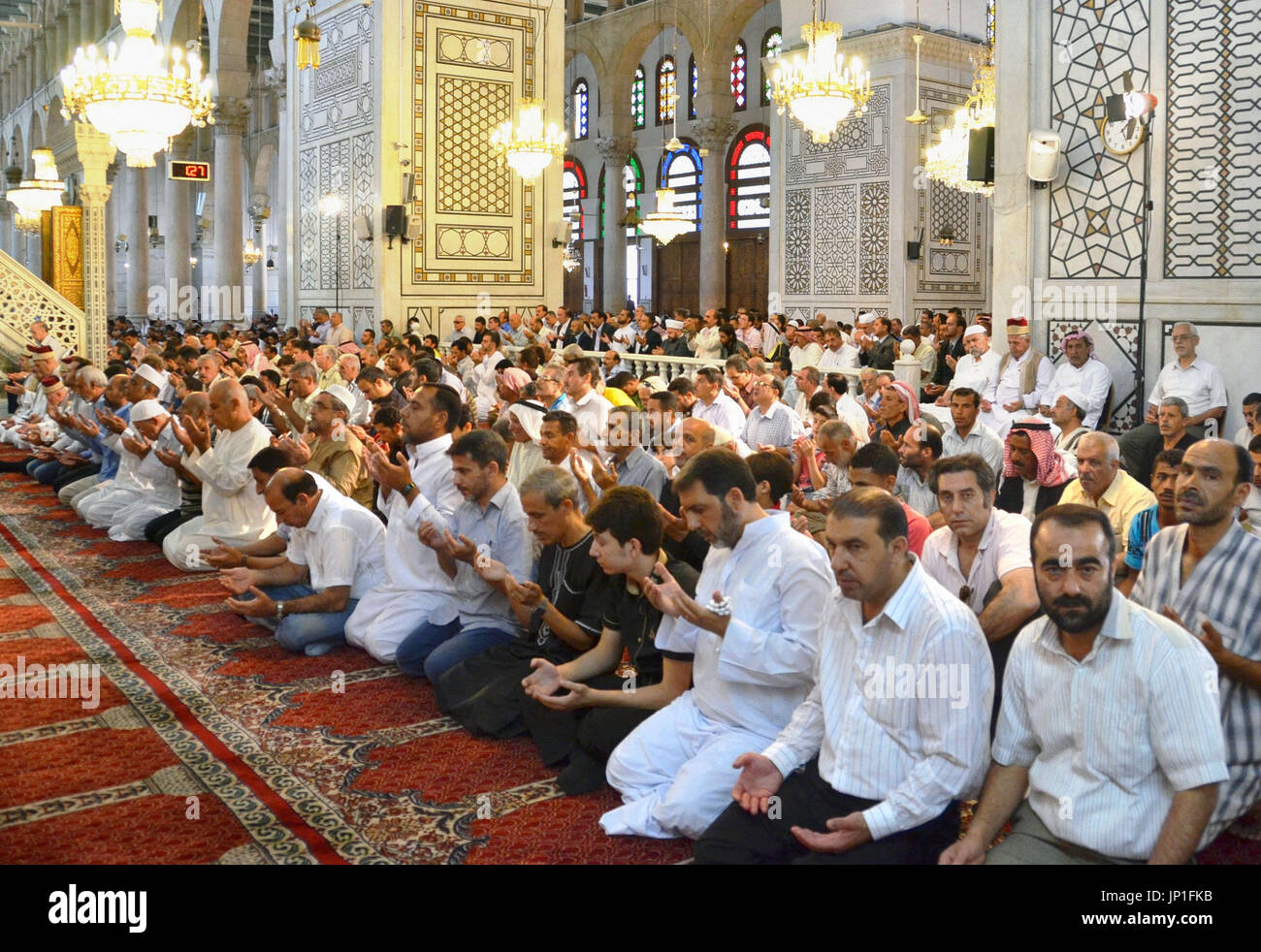 DAMASCUS, Syria - Muslims attend a Friday prayer meeting at Umayyad ...