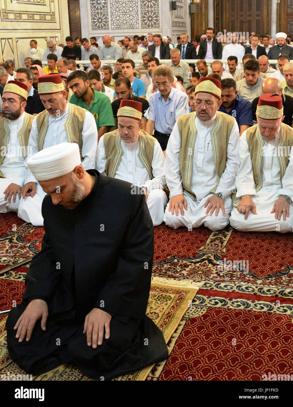 DAMASCUS, Syria - Muslims attend a Friday prayer meeting at Umayyad ...