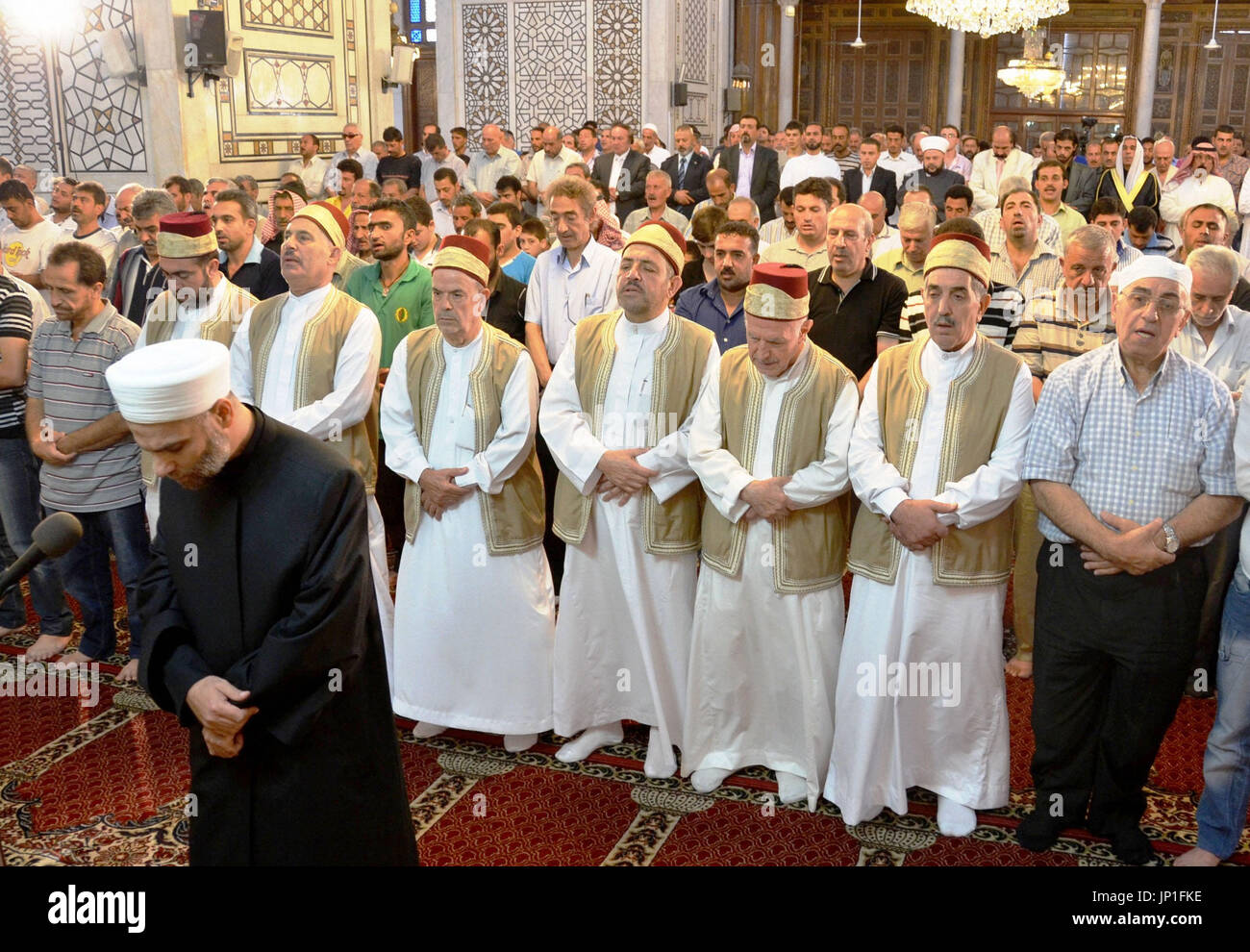 DAMASCUS, Syria - Muslims attend a Friday prayer meeting at Umayyad ...