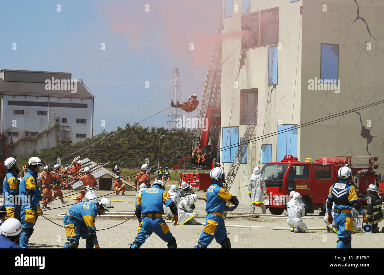CHIBA, Japan - Police officers and firefighters participate in a rescue ...