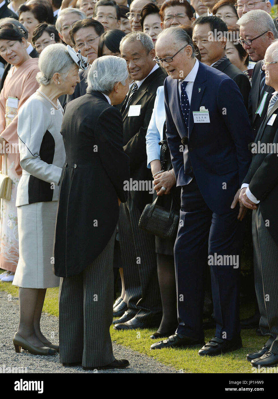 TOKYO, Japan - Emperor Akihito (pictured from behind) and Empress ...