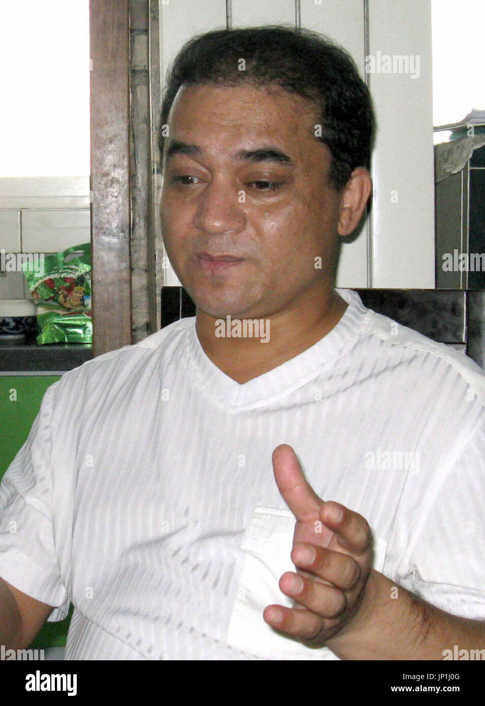 BEIJING, China - File photo shows Uyghur scholar Ilham Tohti during an ...