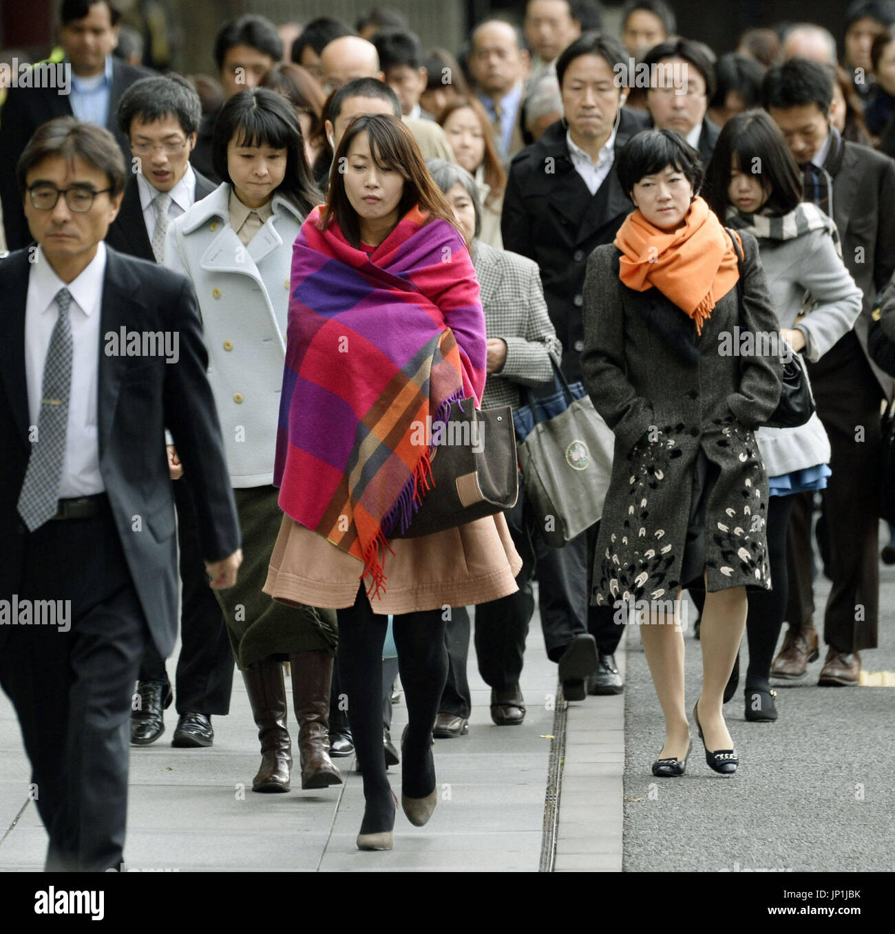 TOKYO, Japan - Tokyoites walk to work in Tokyo's Marunouchi business ...
