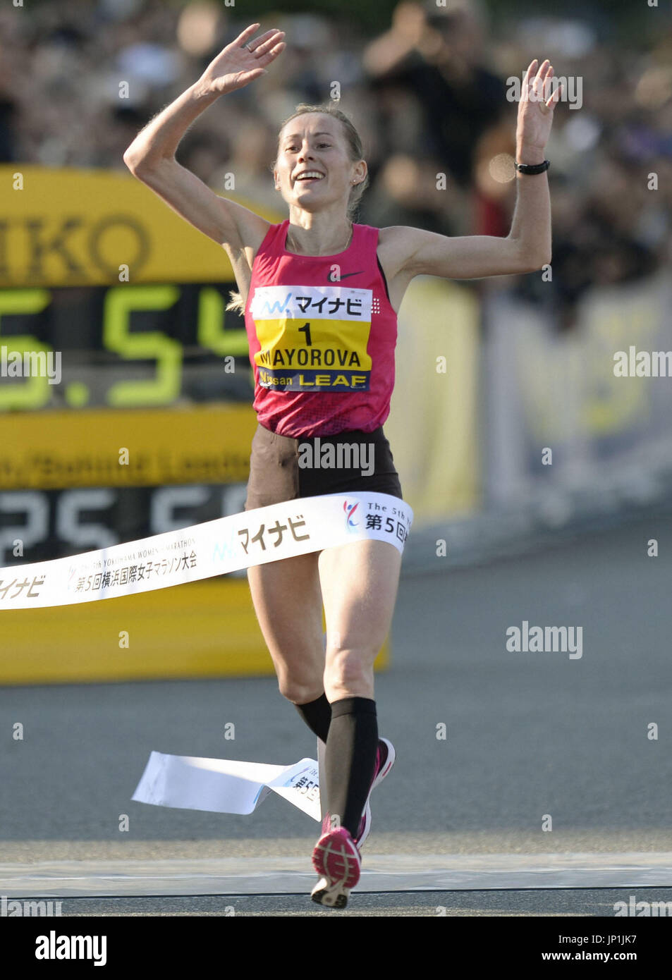 YOKOHAMA, Japan - Russia's Albina Mayorova crosses the finish line to ...
