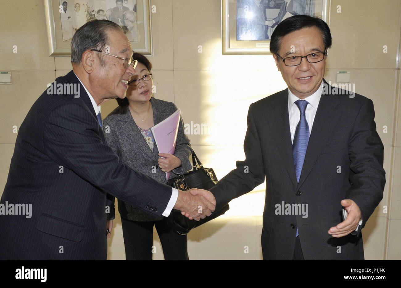 BEIJING, China - Fujio Cho (L), Toyota Motor Corp. honorary chairman ...