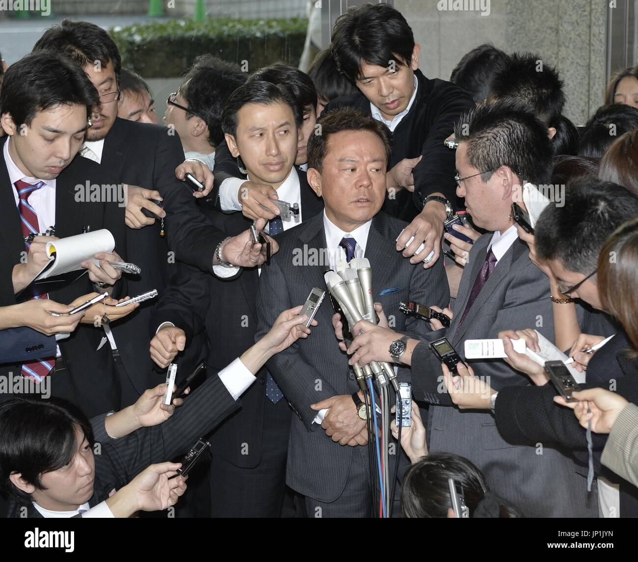 TOKYO, Japan - Tokyo Gov. Naoki Inose is surrounded by reporters at the ...