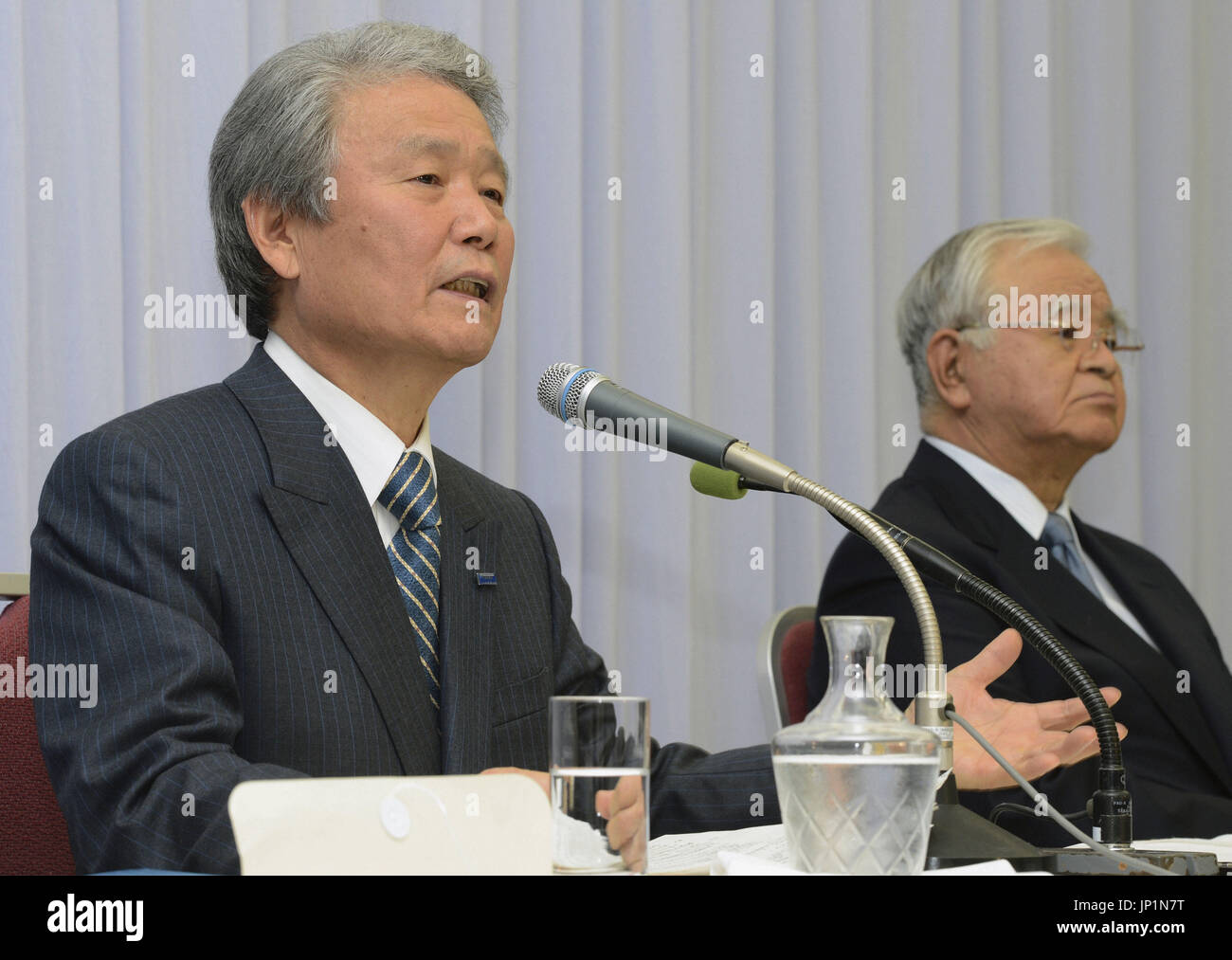 TOKYO, Japan - Toray Industries Inc. Chairman Sadayuki Sakakibara (L ...
