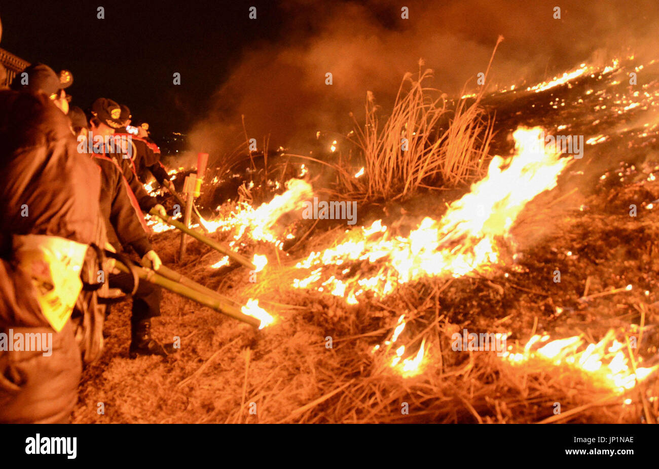 NARA, Japan - Local fire volunteers set fire to the hillside of Mt ...