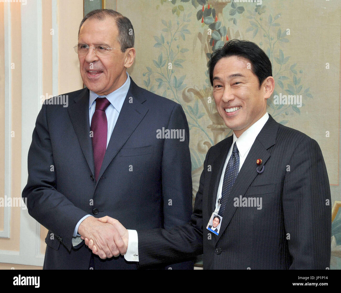 MUNICH, Germany - Japanese Foreign Minister Fumio Kishida (R) and his ...