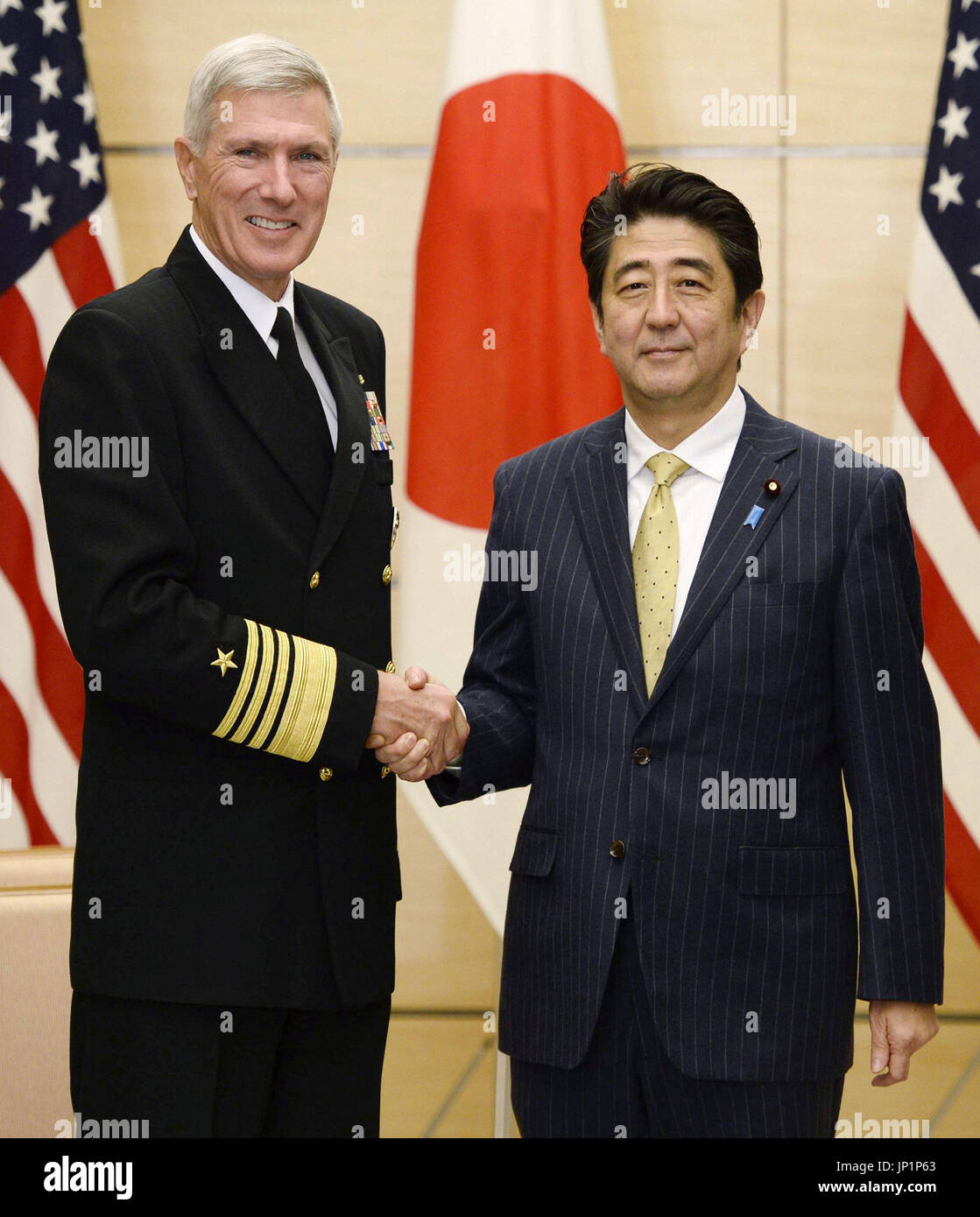 TOKYO, Japan - Japanese Prime Minister Shinzo Abe (R) shakes hands with ...