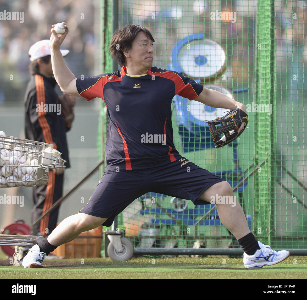 MIYAZAKI, Japan - Former Yomiuri Giants and New York Yankees star Hideki Matsui throws a ball as ...
