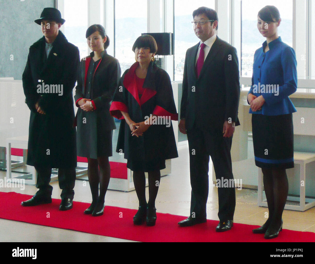 OSAKA, Japan - Staff of the Osaka Marriott Miyako Hotel model uniforms ...
