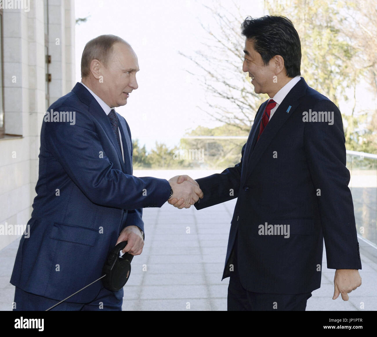 SOCHI, Russia - Russian President Vladimir Putin (L) welcomes Japanese ...