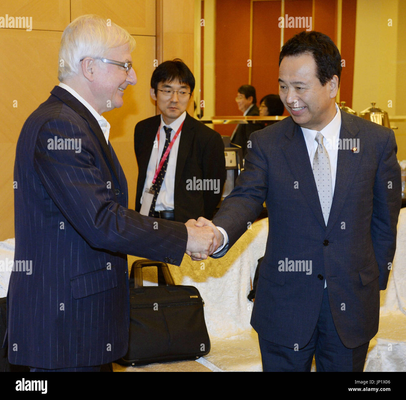 SINGAPORE, Singapore - Akira Amari (R), Japan's minister in charge of ...