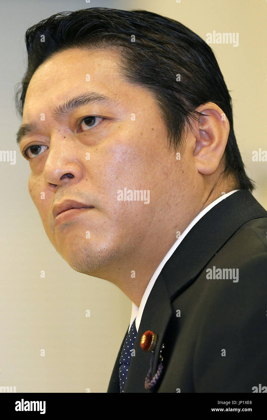 TOKYO, Japan - House of Representatives member Takeshi Tokuda attends a ...