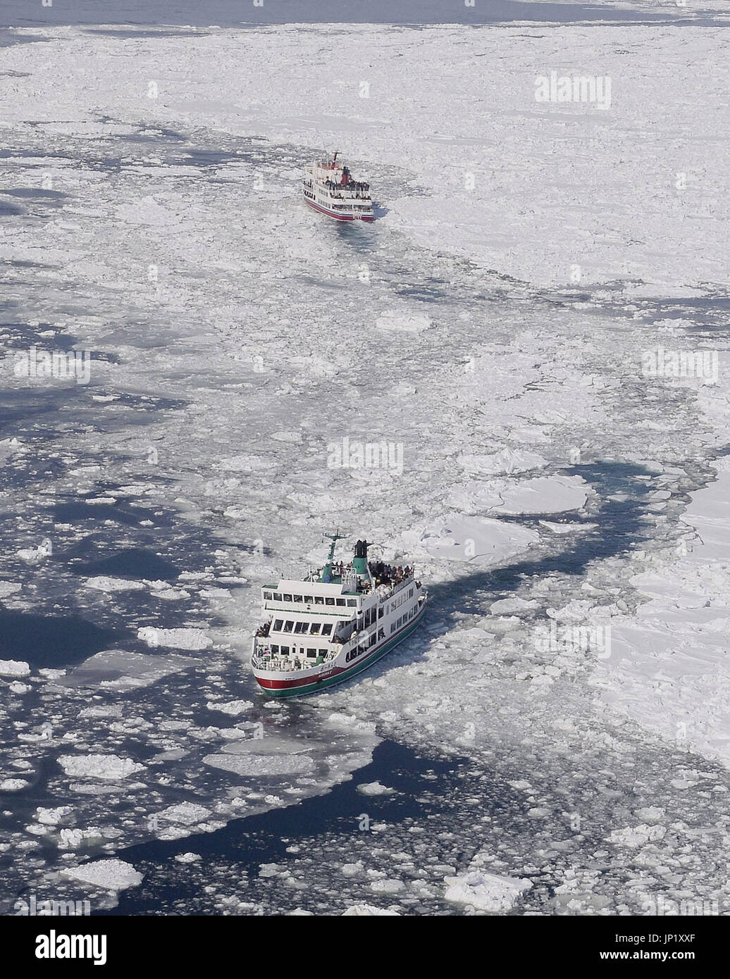 SAPPORO, Japan - Two ice-breaking cruise ships navigate through drift ...