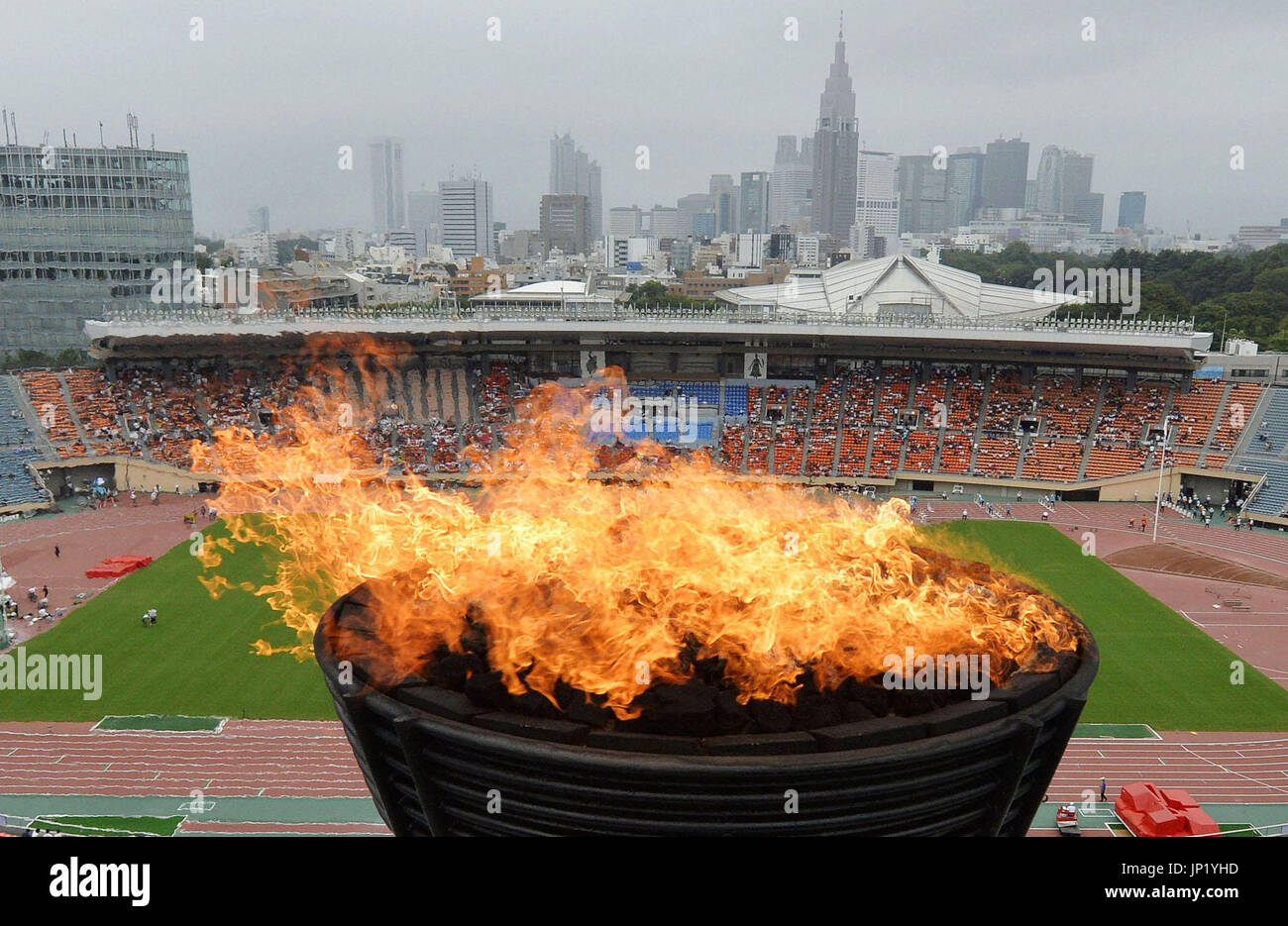 TOKYO, Japan - A flame is lit in the 1964 Tokyo Olympics cauldron in celebration at the National ...