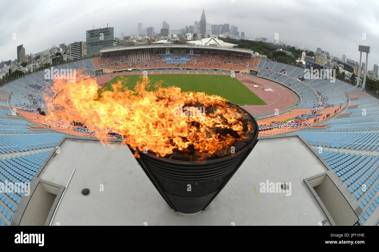 TOKYO, Japan - A flame is lit in the 1964 Tokyo Olympics cauldron in celebration at the National ...