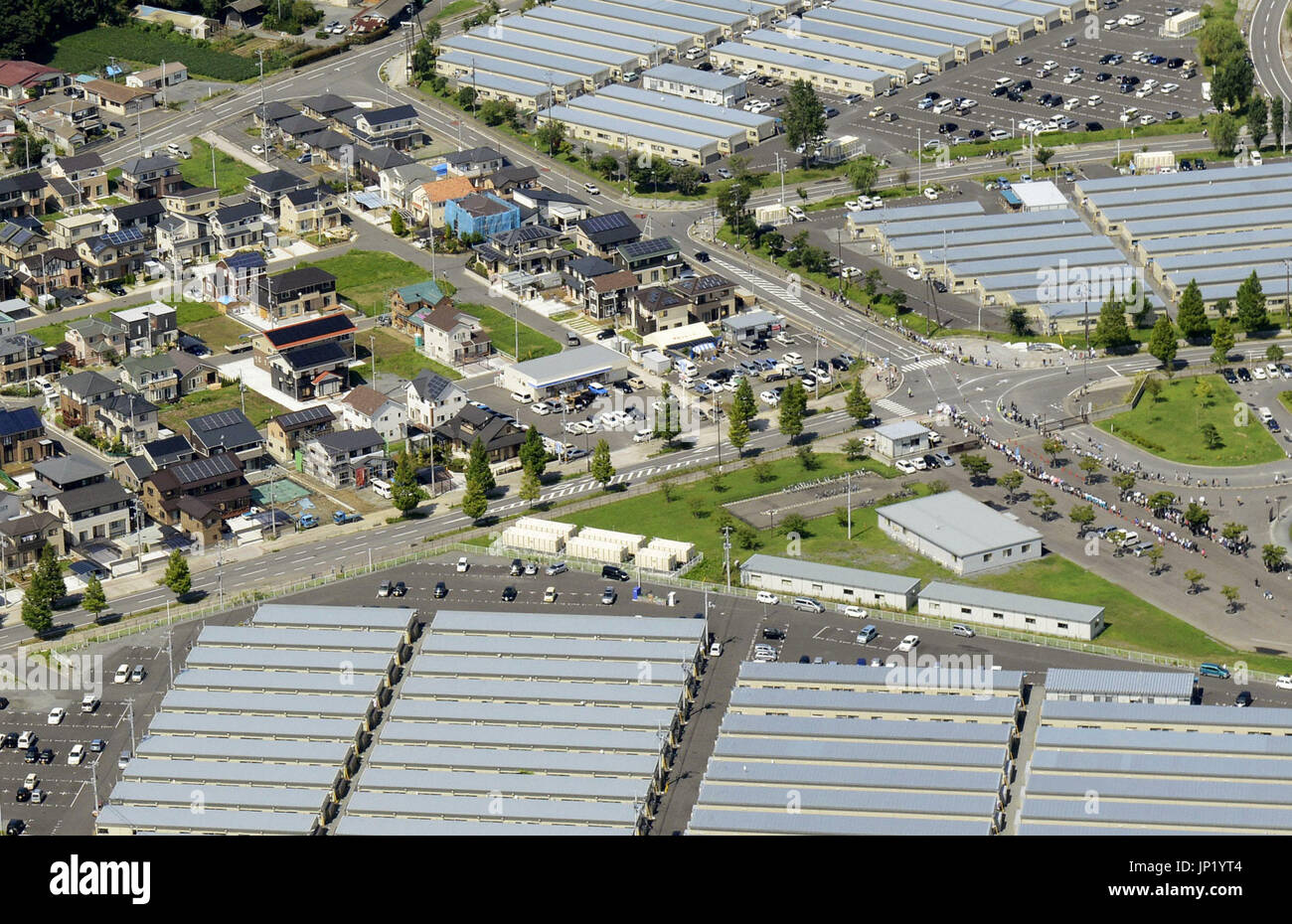 SENDAI, Japan - Photo taken from a Kyodo News helicopter shows a new ...