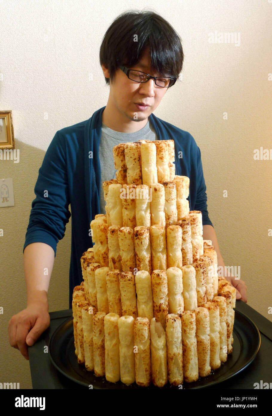 TOKYO, Japan - Koshi Kawachi displays the statues of Buddha he carved ...