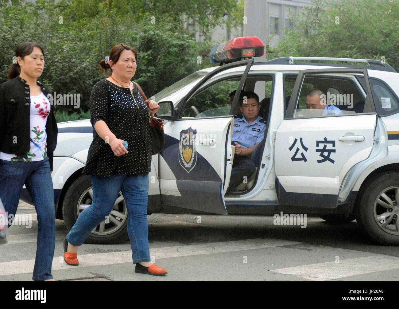 BEIJING, China - Police officers stand guard near the Japanese Embassy ...