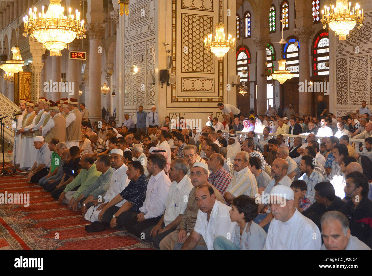 DAMASCUS, Syria - Muslims attend a Friday prayer meeting at Umayyad ...
