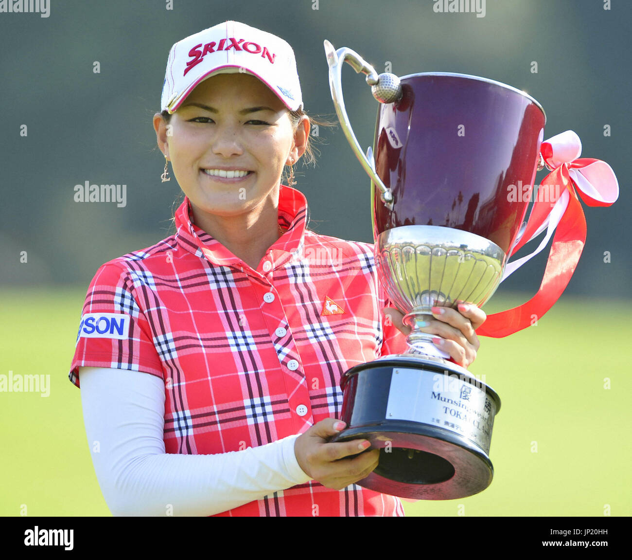 MIHAMA, Japan - Japan's Sakura Yokomine holds the victor's trophy after ...