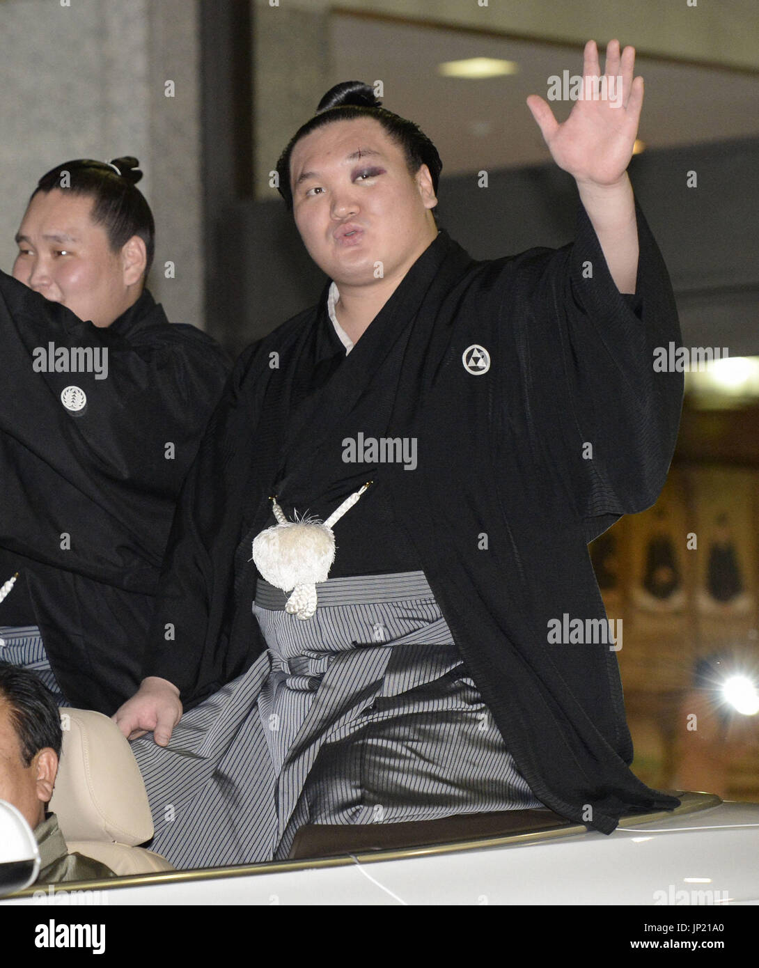 TOKYO, Japan - Yokozuna Hakuho waves during his victory parade at ...