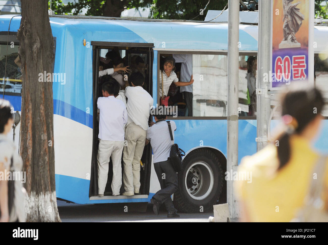 PYONGYANG, North Korea - A bus is packed with passengers in Pyongyang ...